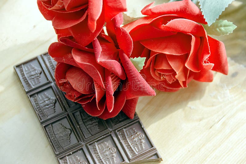 Red roses and chocolate stock image. Image of symbol - 119556053