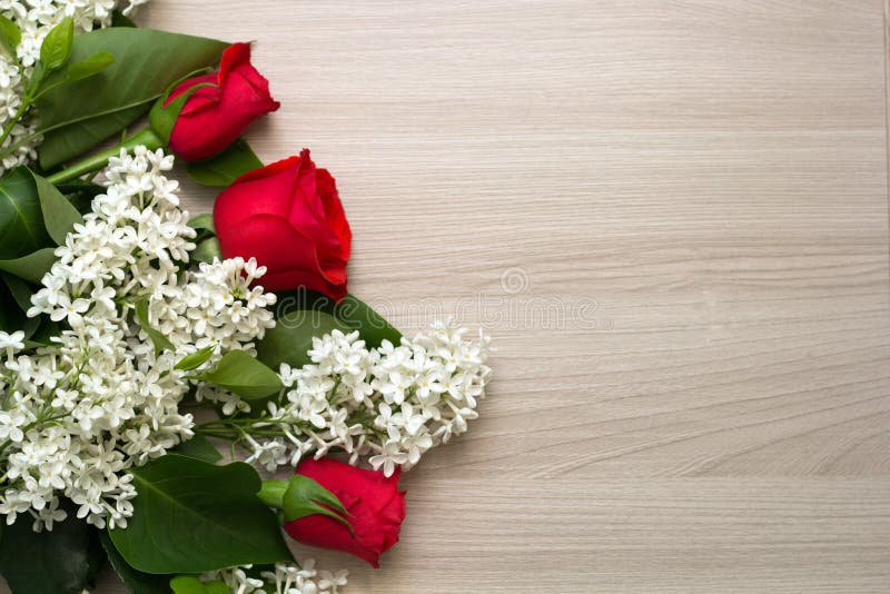 Red Roses and Lilac on the Table Stock Image - Image of table, roses ...