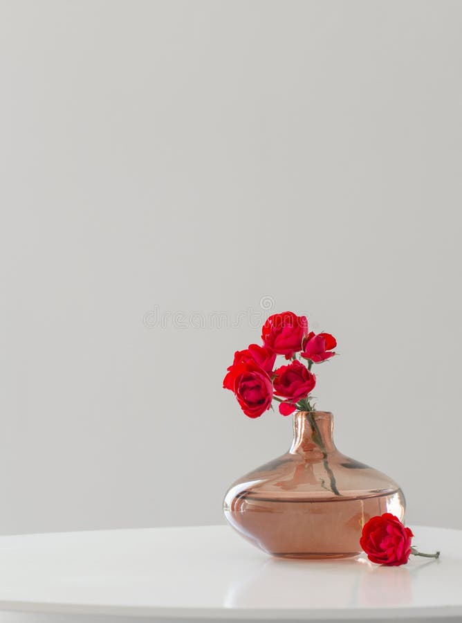 Red Roses in Modern Glass Vase in White Interior Stock Photo - Image of ...