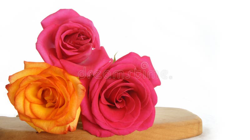 Red Roses and Orange Rose on Wooden Table Stock Image - Image of ...