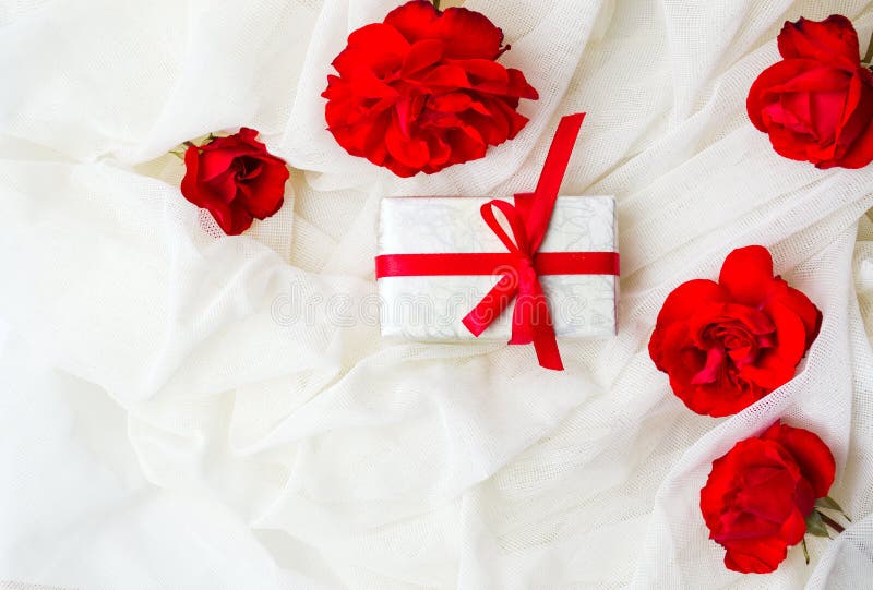 Red Roses and a Present Box Stock Image - Image of gift, rose: 99898427