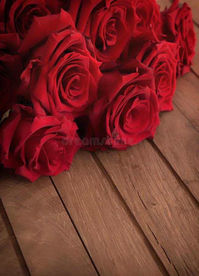 Red roses on table stock photo. Image of floral, bloom - 87789404