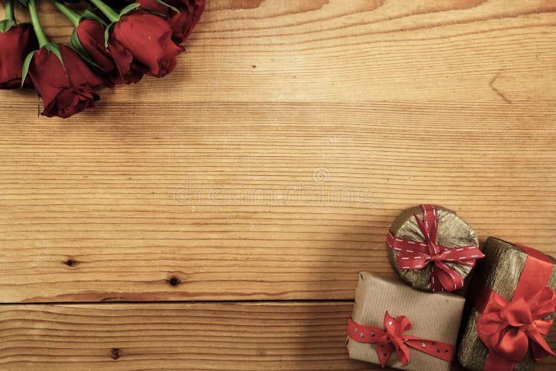 Red Roses and Three Gift Boxes on Wood with Copy Space Stock Image ...