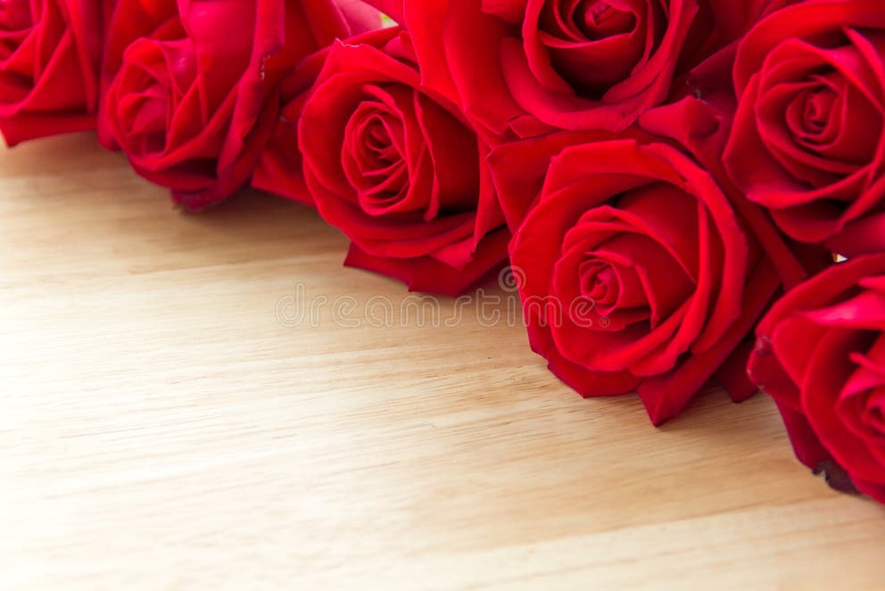 Red roses on wood table stock image. Image of romance - 86347701