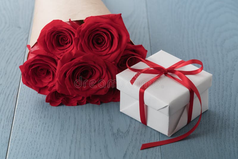 Red Roses on Wood Table with Gift Box Stock Image - Image of holiday ...