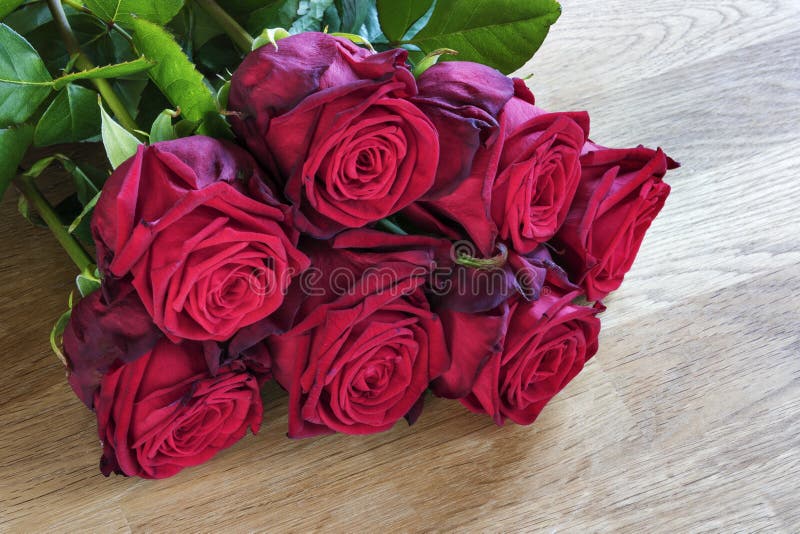 Red roses on table stock image. Image of space, wood - 121581709