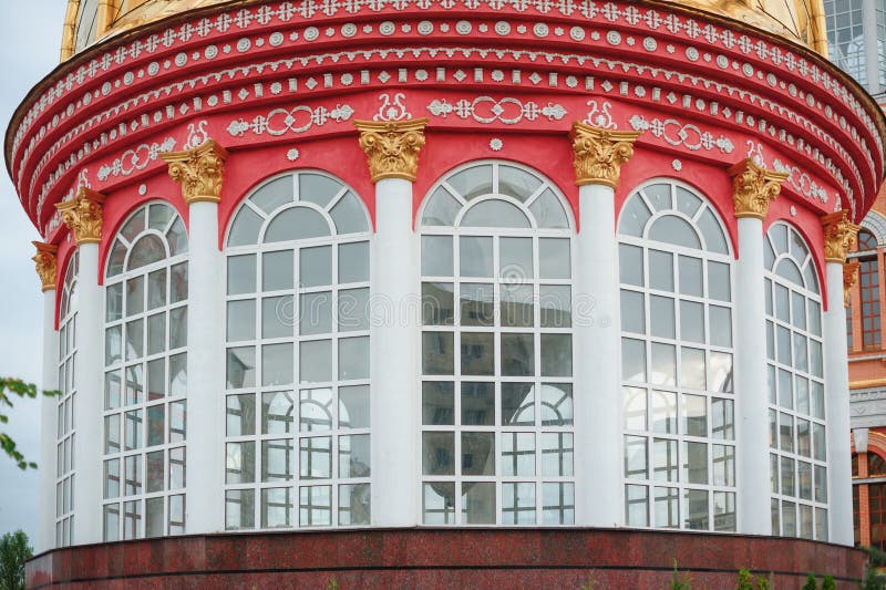 Red Round Building with Large Windows and Columns Stock Photo - Image ...