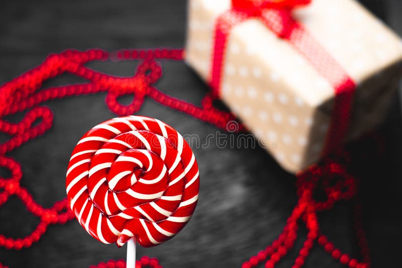 Red, Round Colored Lollipop on Black Background Stock Photo - Image of ...