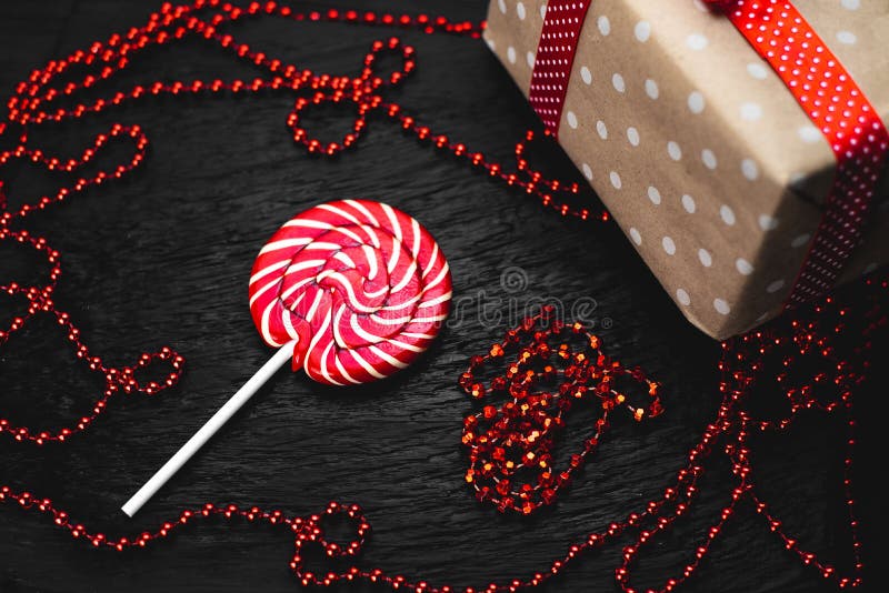 Red, Round Colored Lollipop on Black Background Stock Photo - Image of ...