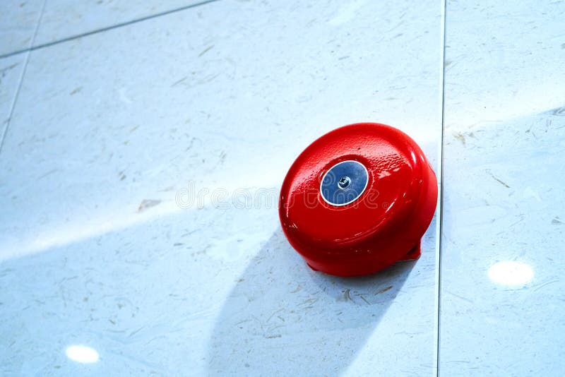 Red Round Fire Emergency Alarm Hoot on the Light Blue Wall Stock Photo ...