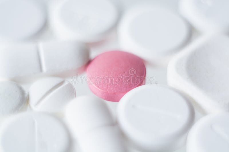 Red Round Pill Lying among White Drugs Stock Photo - Image of caplet ...
