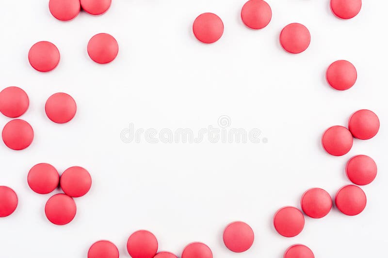 Red Round Tablets on a White Background with a Copyspace Stock Photo ...