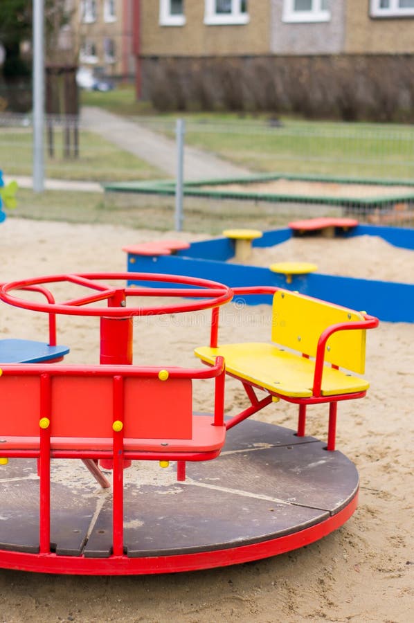 Red roundabout stock photo. Image of sand, yellow, metal - 65936784