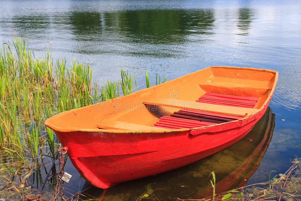 Red rowing boat stock image. Image of grunge, grass, transportation ...
