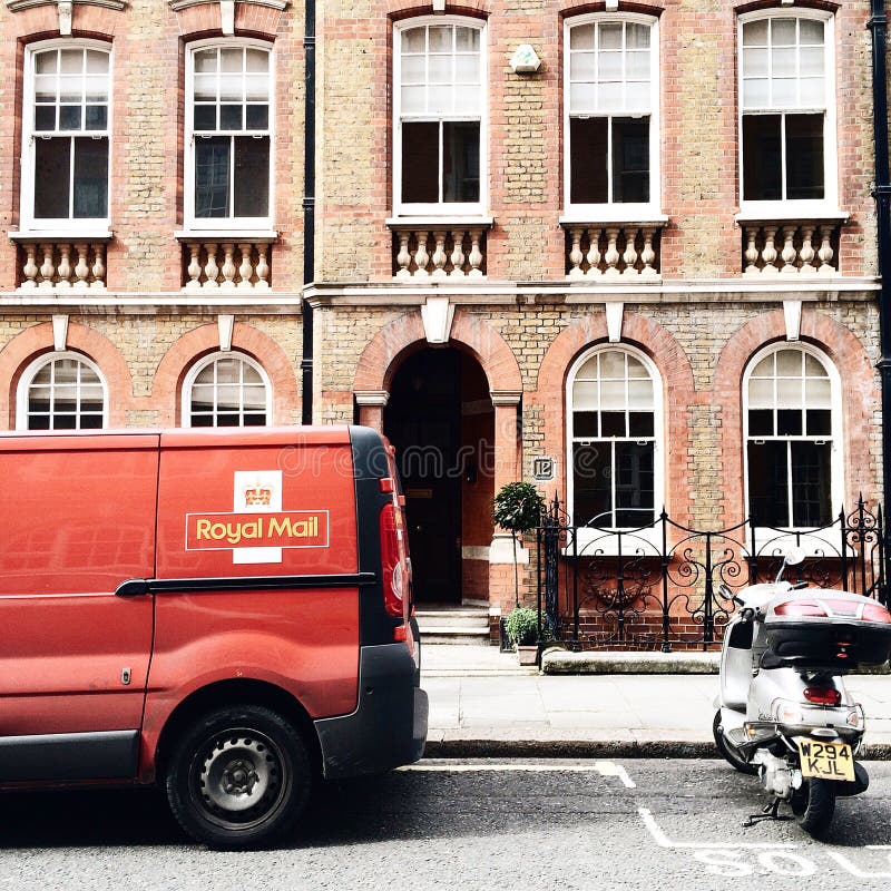 Red Royal Mail Parked Near Brown Brick Building Picture. Image: 109910510