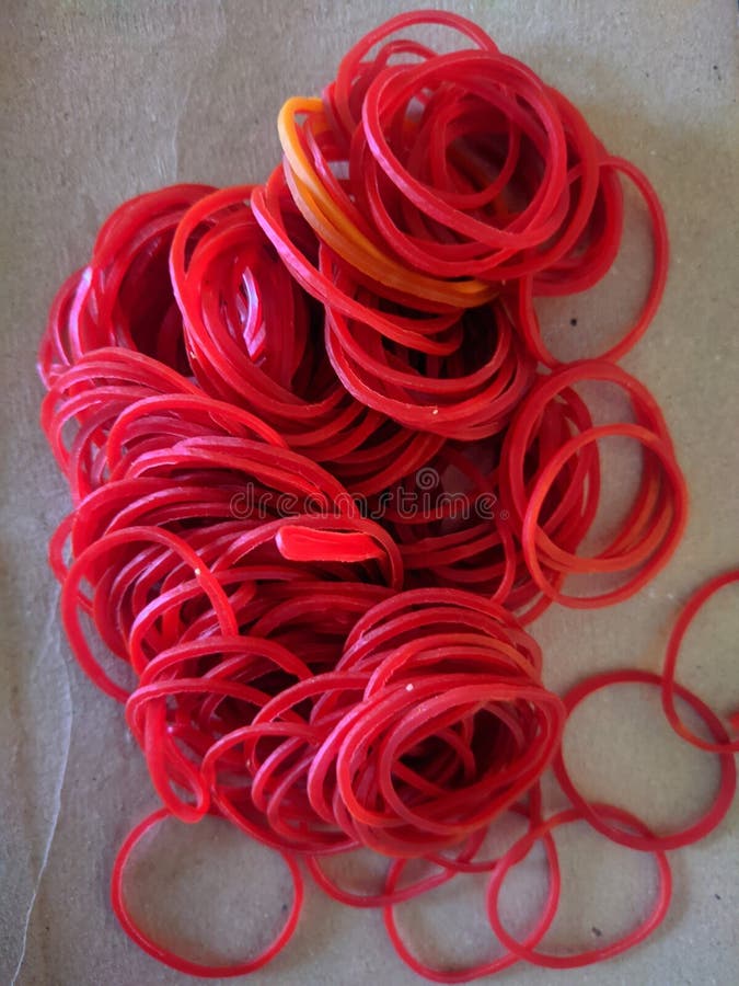 Red rubber band on paper stock image. Image of paper - 338163415