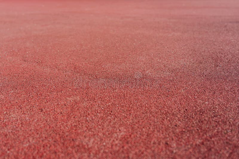 Red Rubber Coating Made of Recycled Rubber Chips on the Sports Field ...