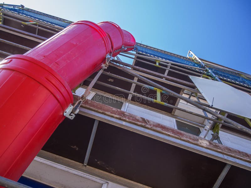 Red Rubble Slide on Scaffolding Stock Photo - Image of rubbish, outside ...