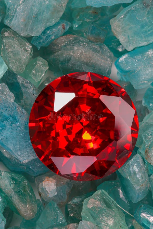Red Ruby Diamond Diamond on Placed on a Pile of Raw Sky Blue Gemstones ...