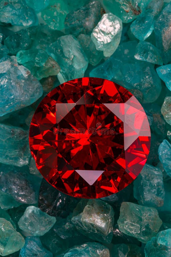 Red Ruby Diamond Diamond on Placed on a Pile of Raw Sky Blue Gemstones ...