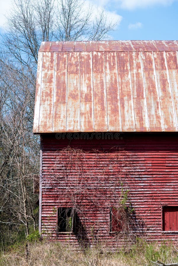 Red Run-Down Barn in Woods stock image. Image of area - 120663513