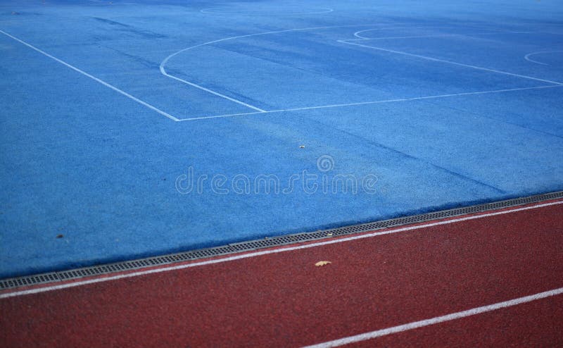 Red Running Track with Blue Sports Field in Left Side Stock Image ...