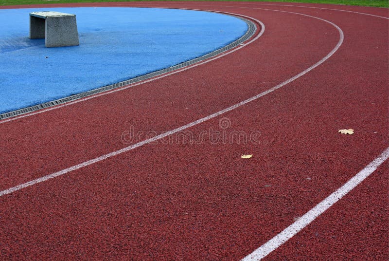 Red Running Track with Blue Sports Field in Left Side Stock Image ...