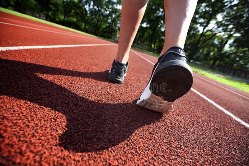 Red Running Track with Female Runner, Close Up on Legs Stock Image ...
