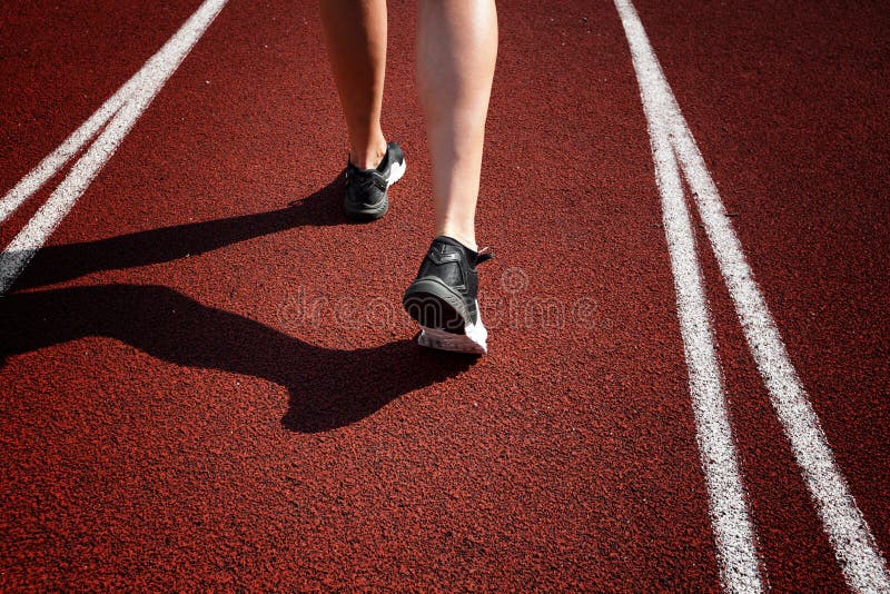 Red Running Track with Female Runner, Close Up on Legs Stock Image ...