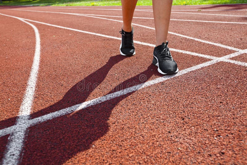 Red Running Track with Female Runner, Close Up on Legs Stock Image ...