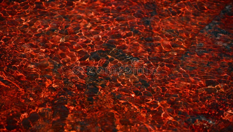 Red Running Water Waves Over Stones Stock Photo - Image of purple ...
