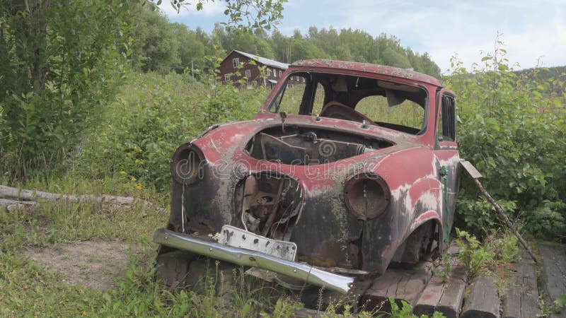 Abandoned Red Car Rusting in Overgrown Field Stock Video - Video of ...