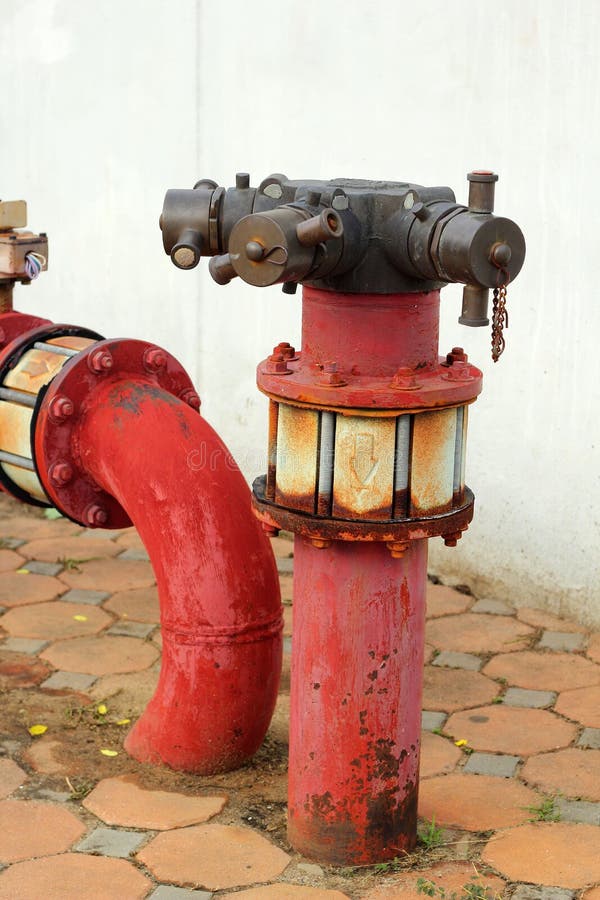 Red Rusty Metal Industrial Water Pipes with a Valve. Stock Photo ...
