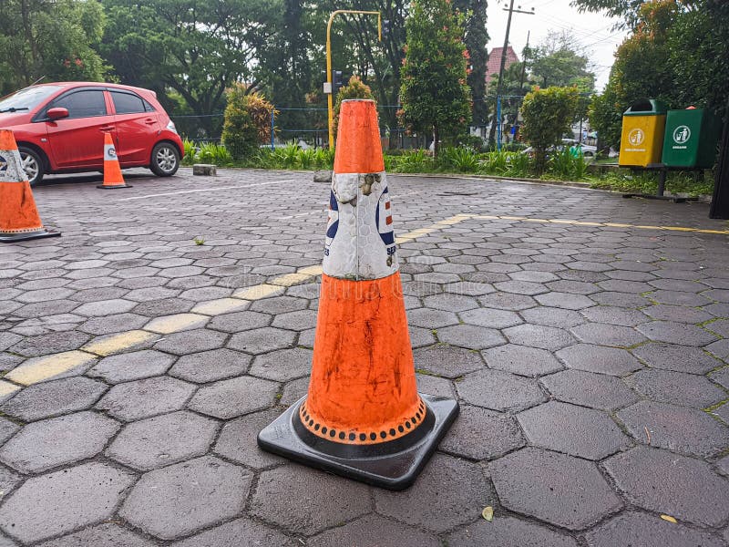 Red Safety Cone in the Parking Lot Outside the Mall Stock Image - Image ...