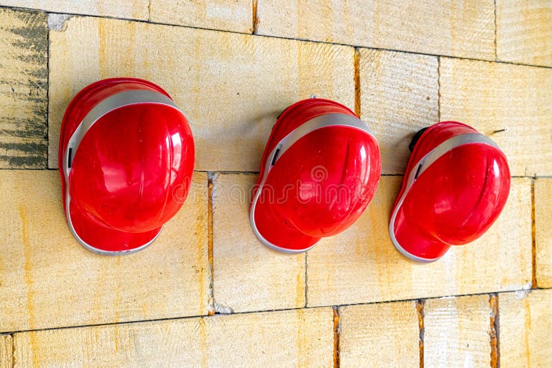 Red Safety Helmets on a Construction Site Stock Photo - Image of ...