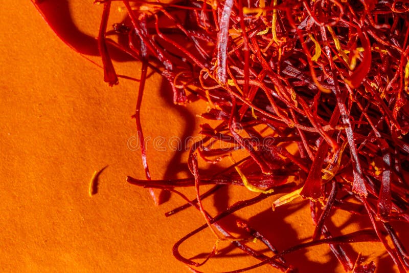 Red Saffron Threads Isolated on Orange Textured Surface Stock Image ...