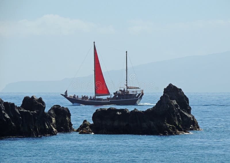 Red Sail black rocks ocean stock photo. Image of wave - 81020142