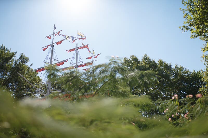 Red sails among trees stock photo. Image of outdoors - 104349810