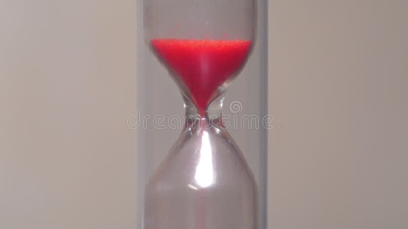 Red Sand in Hourglass. Time Flows Backwards, in the Opposite Direction ...