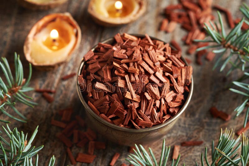 Red Sandalwood Chips in a Bowl with Christmas Candles and Spruce Tree ...