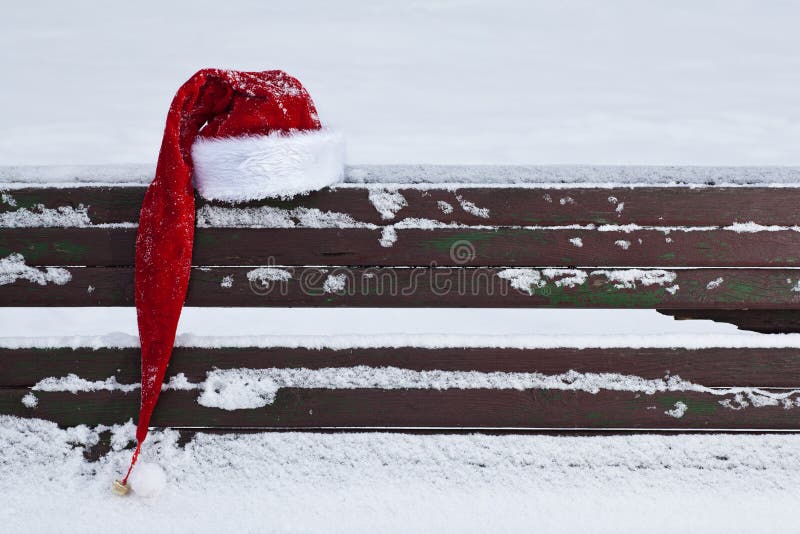 Red Santa Claus Hat on Snow Covered Bench Stock Image - Image of ...