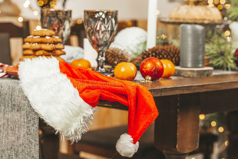 Red Santa Claus Hat on a Table with Christmas Dinner Setting Stock ...
