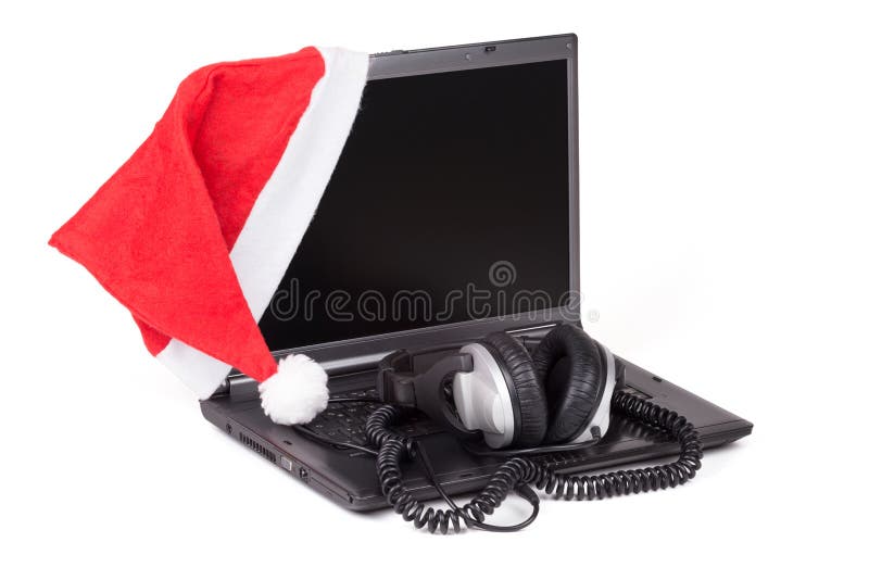 Red Santa Hat on the Notebook Computer with Headphones Stock Photo ...