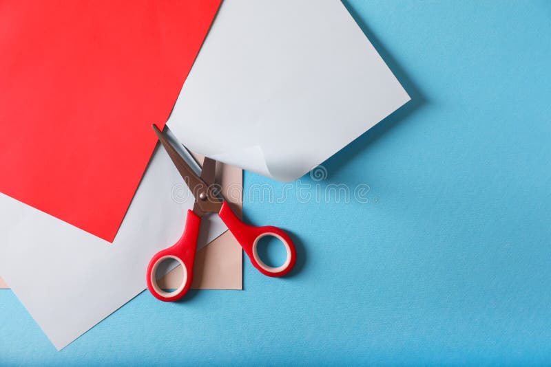 Red Scissors and Color Sheets of Paper on Light Blue Background, Flat ...