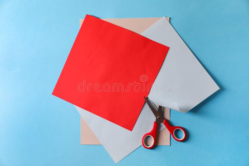 Red Scissors and Color Sheets of Paper on Light Blue Background, Flat ...