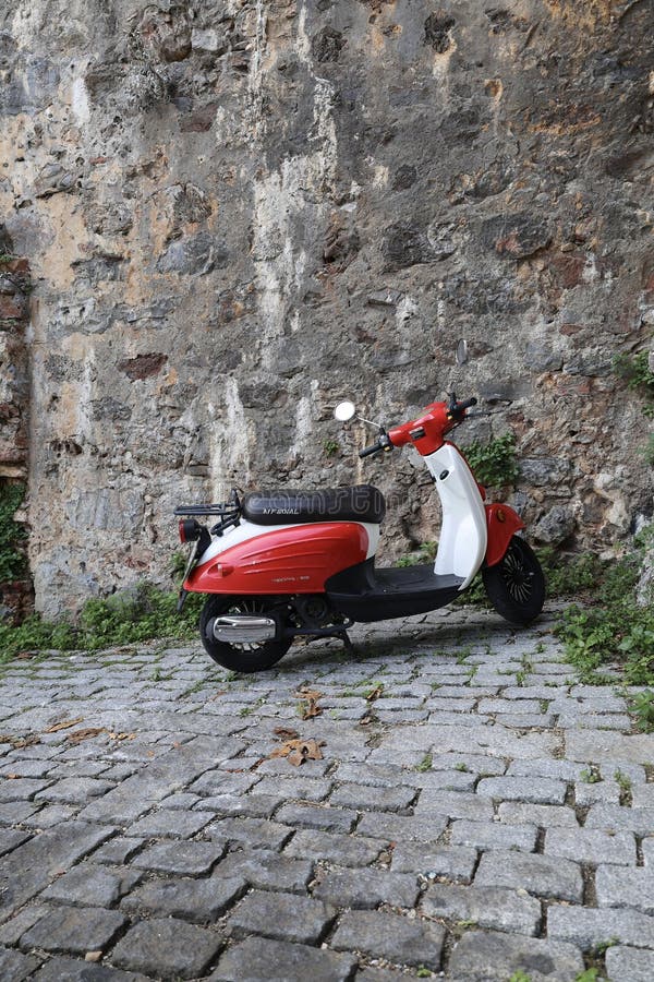 Red scooter wall stock photo. Image of architecture - 355270430