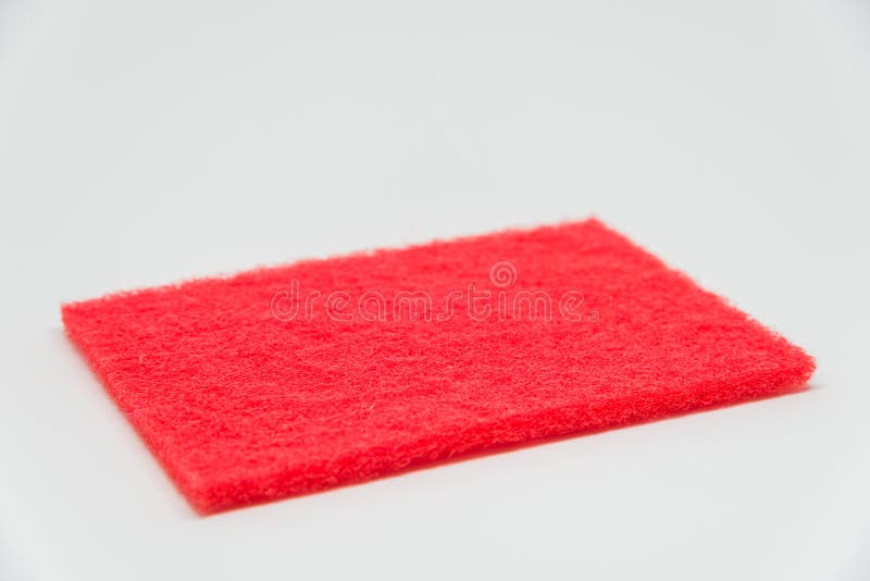 Red Scouring Pad with White Background and Selective Focus Stock Image ...
