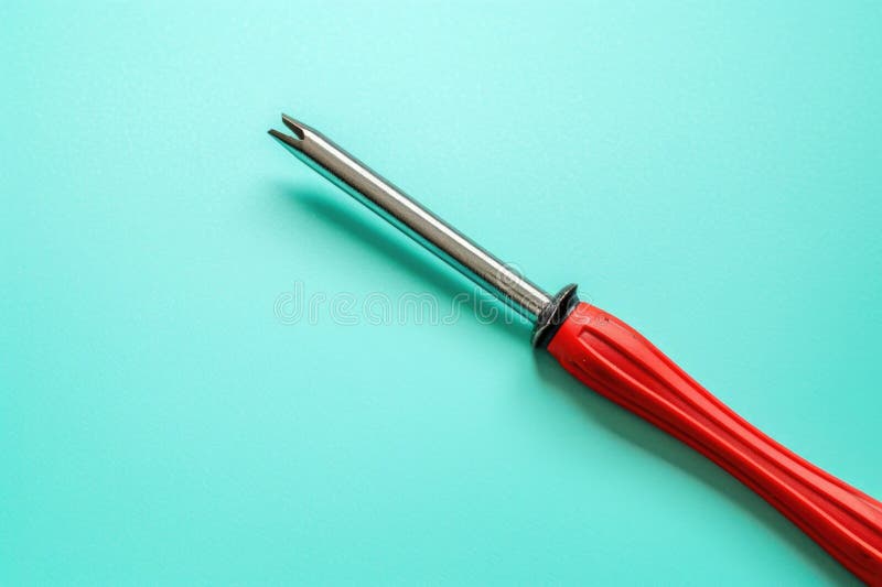 A Red Screwdriver Laying on a Green Surface. Suitable for Industrial or ...