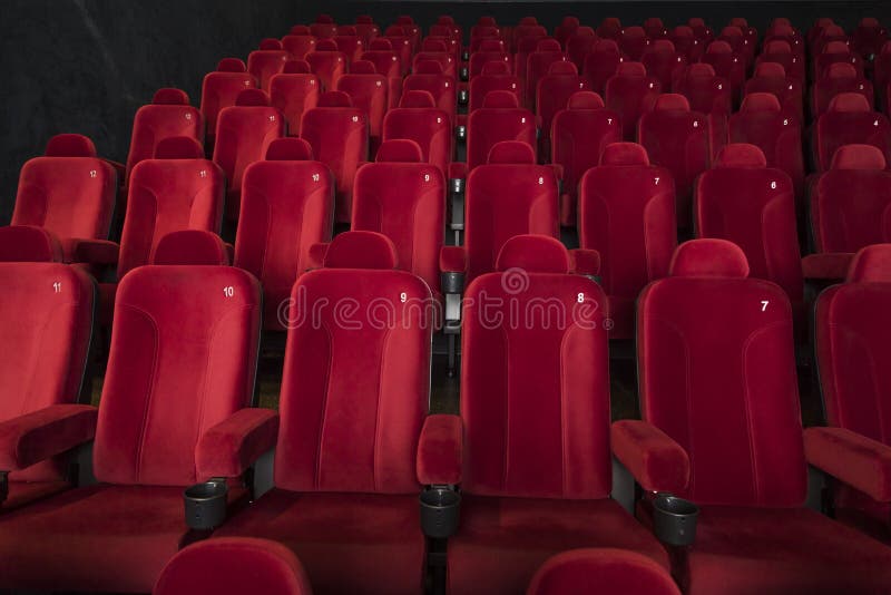 Red seats in cinema stock image. Image of audience, indoor - 115680091