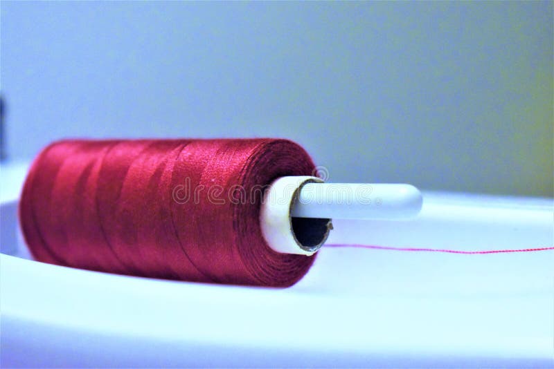 Red Sewing Thread on a Sewing Machine Stock Photo - Image of modern ...